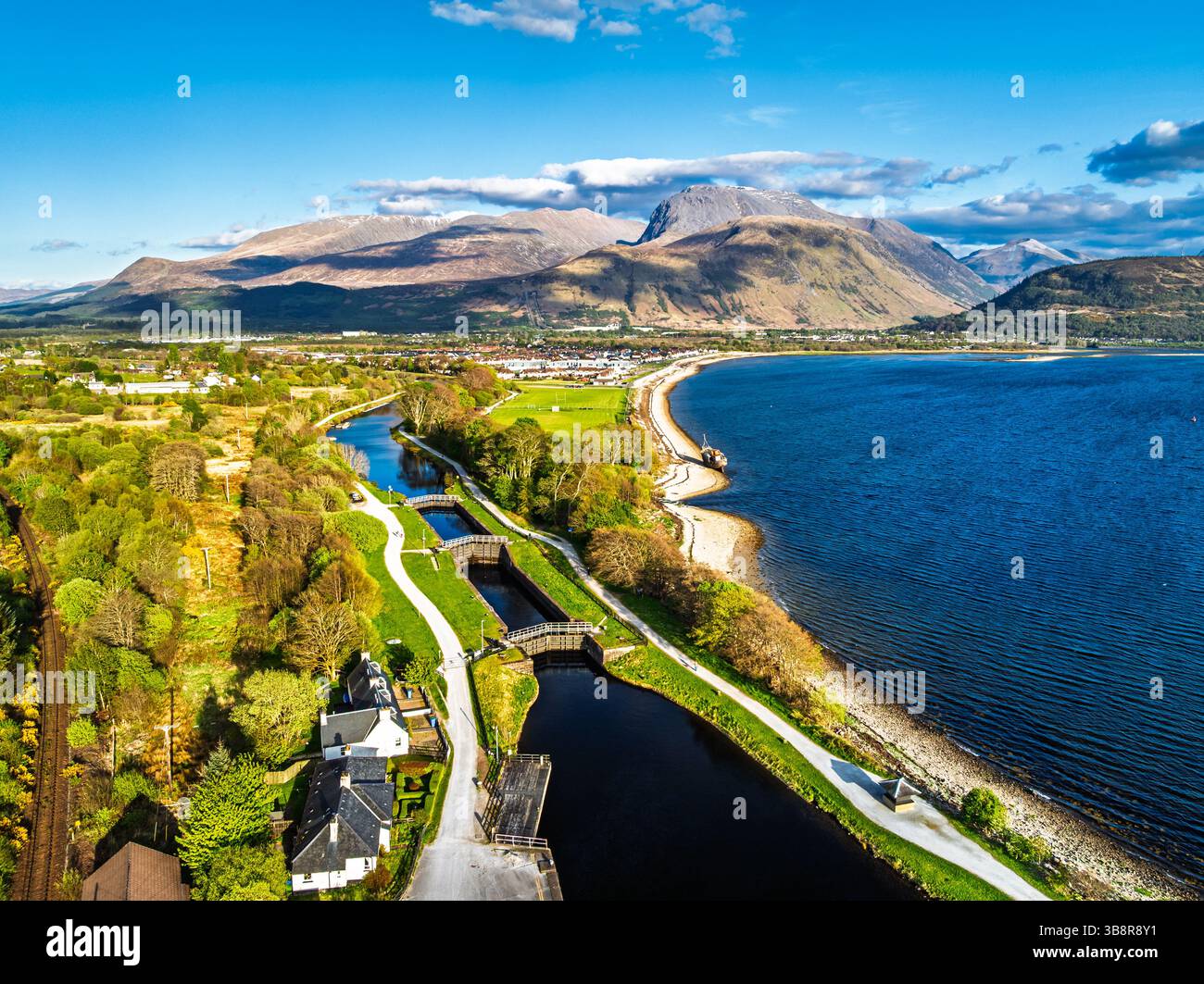 View of Caledonian Canal, Caol Beach and Nevis Range Mountains from a ...