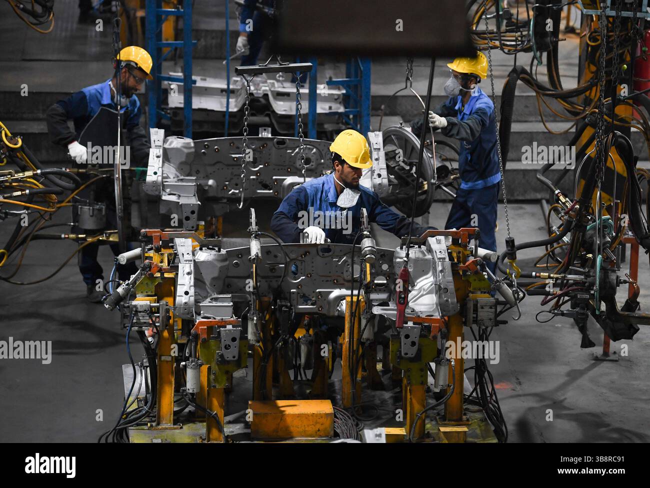Bam, Iran. 3rd May, 2025. Workers work at an assembling workshop of ...