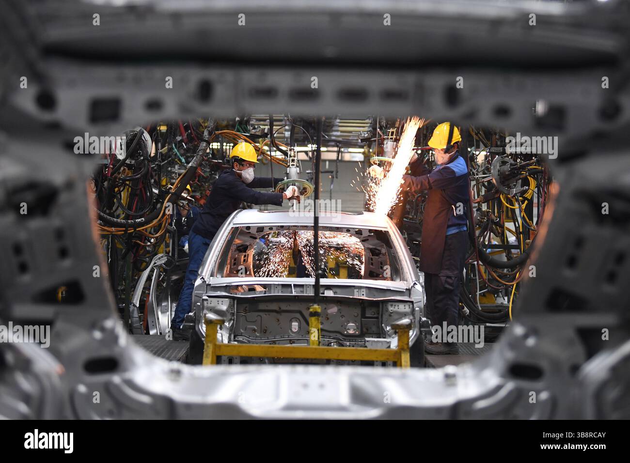 Bam, Iran. 3rd May, 2025. Workers work at an assembling workshop of ...