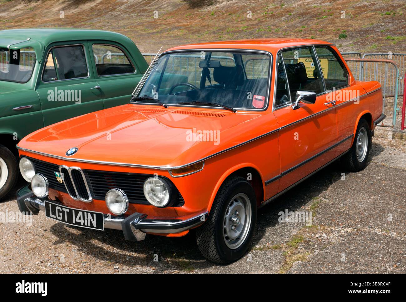 Three-quarters Front View of an Orange, 1975, BMW 02 Series, on display ...