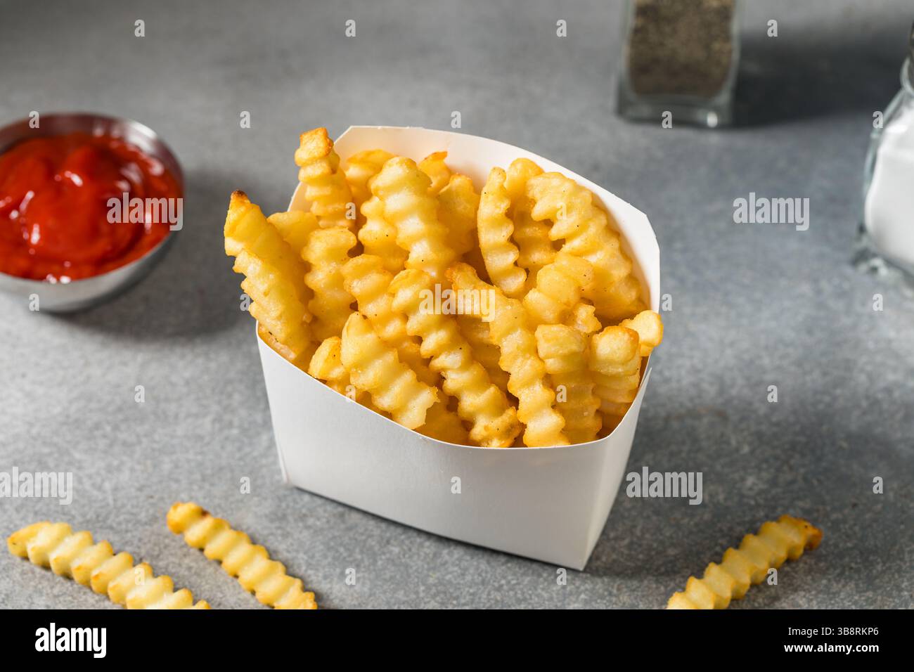Homemade Crinkle Cut French Fries with Sea Salt Stock Photo - Alamy