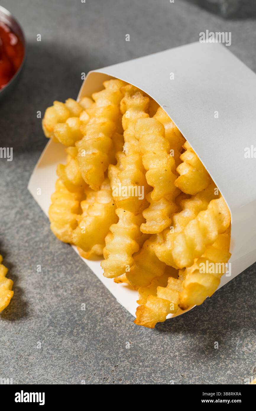 Homemade Crinkle Cut French Fries with Sea Salt Stock Photo - Alamy