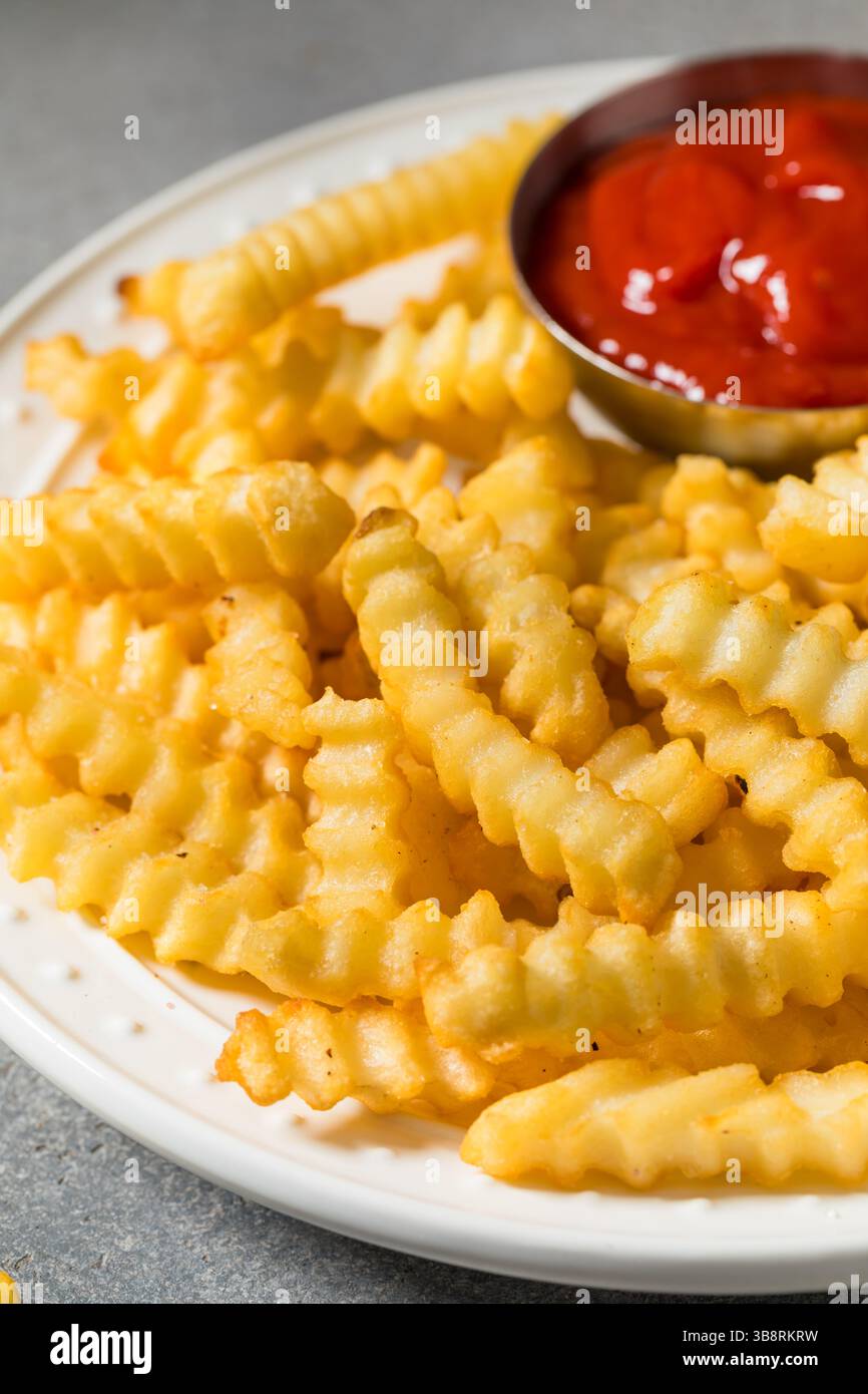 Homemade Crinkle Cut French Fries with Sea Salt Stock Photo - Alamy
