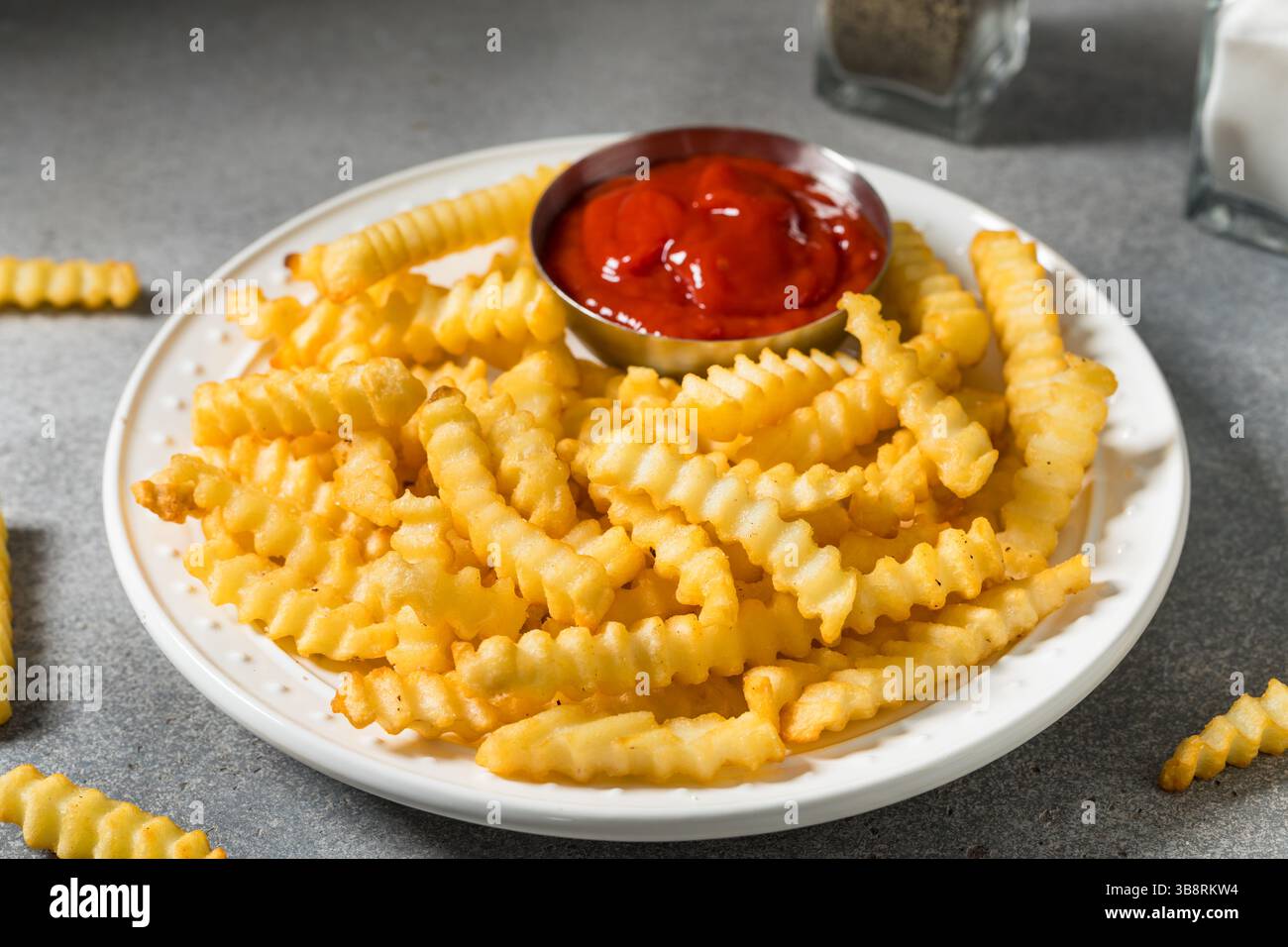 Homemade Crinkle Cut French Fries with Sea Salt Stock Photo - Alamy