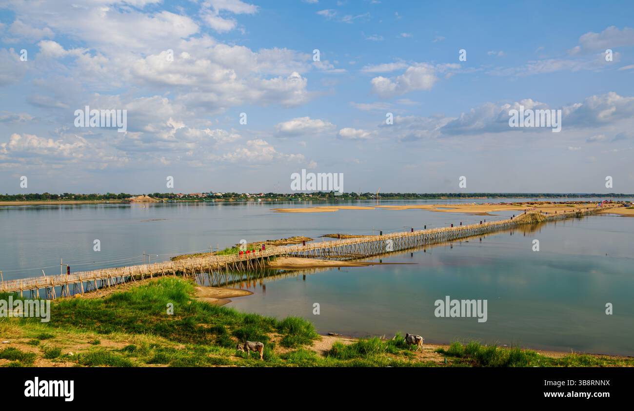 Buddhist monks walk over the bamboo bridge between Kampong Cham and ...