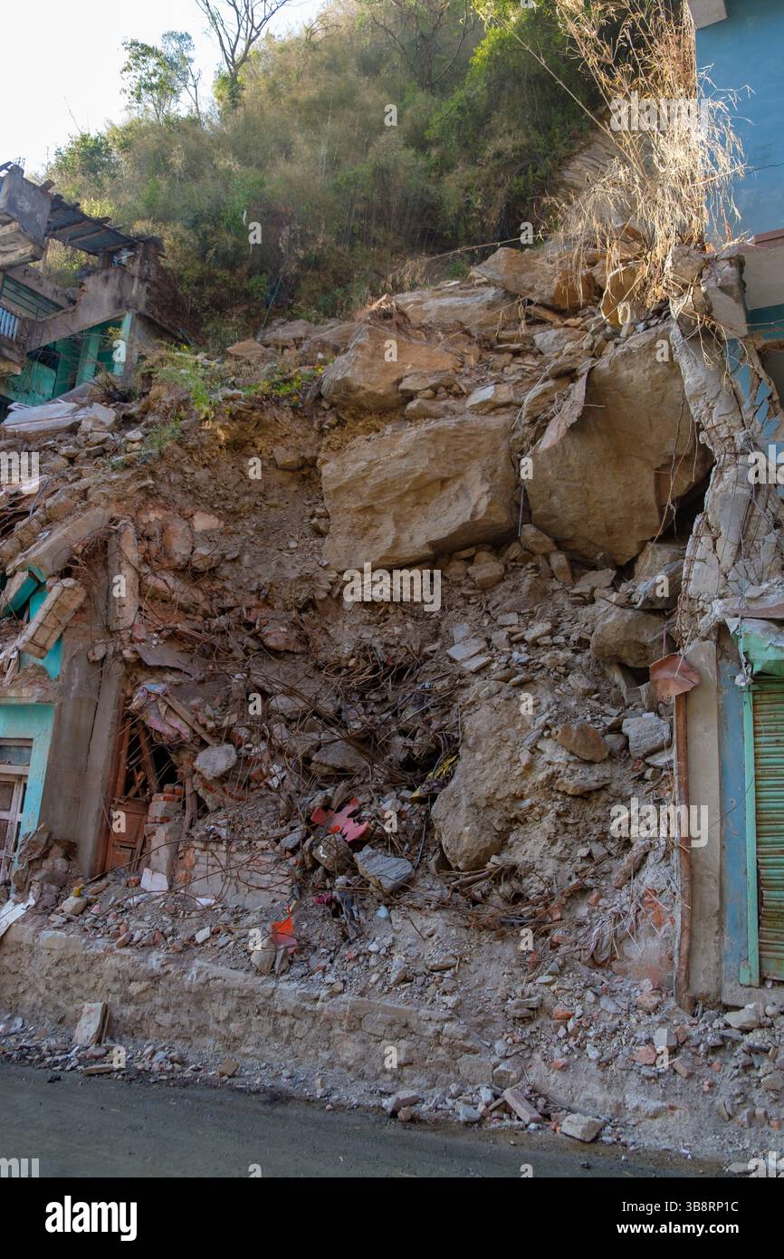 A landslide has destroyed buildings in a town, likely due to heavy rains or an earthquake Stock ...