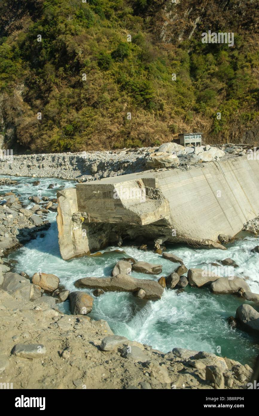 Damaged dam in a river. The structure failed due to erosion or natural ...