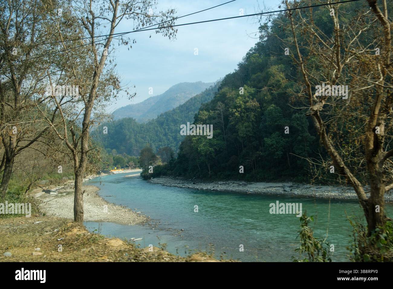 Scenic view of the Teesta River flowing through the mountains in West ...