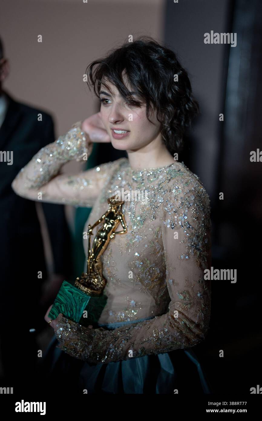 Tecla Insolia with the Best Actress Award attends the photocall during ...
