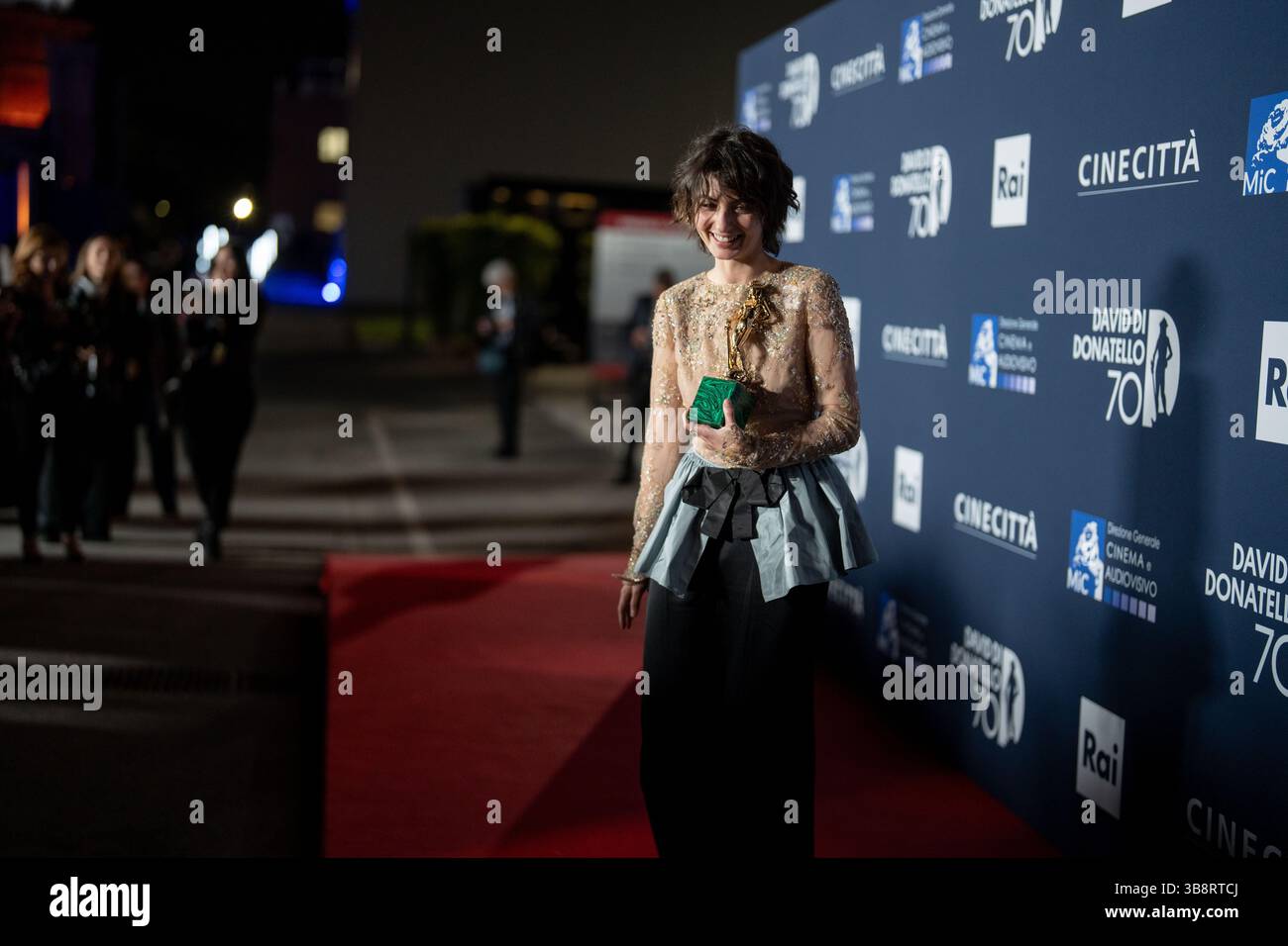Tecla Insolia with the Best Actress Award attends the photocall during ...