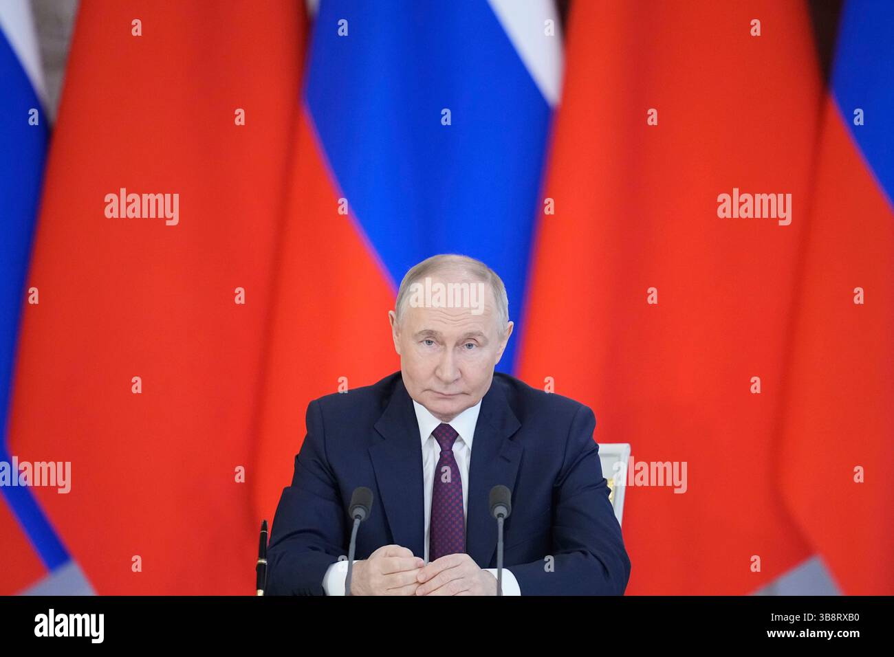 Russian President Vladimir Putin attends a signing ceremony with ...