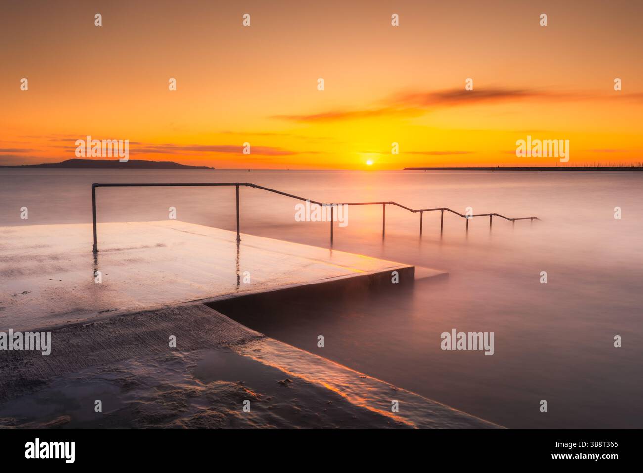 Sunrise over Seapoint Beach Stock Photo - Alamy