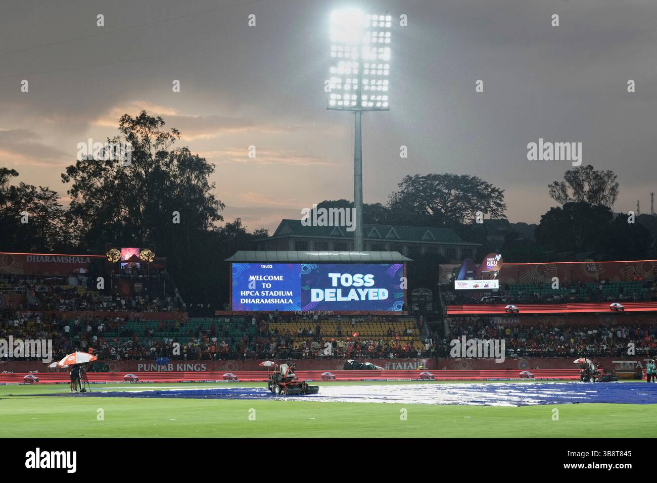 A message is displayed on a screen after the toss is delayed due to ...