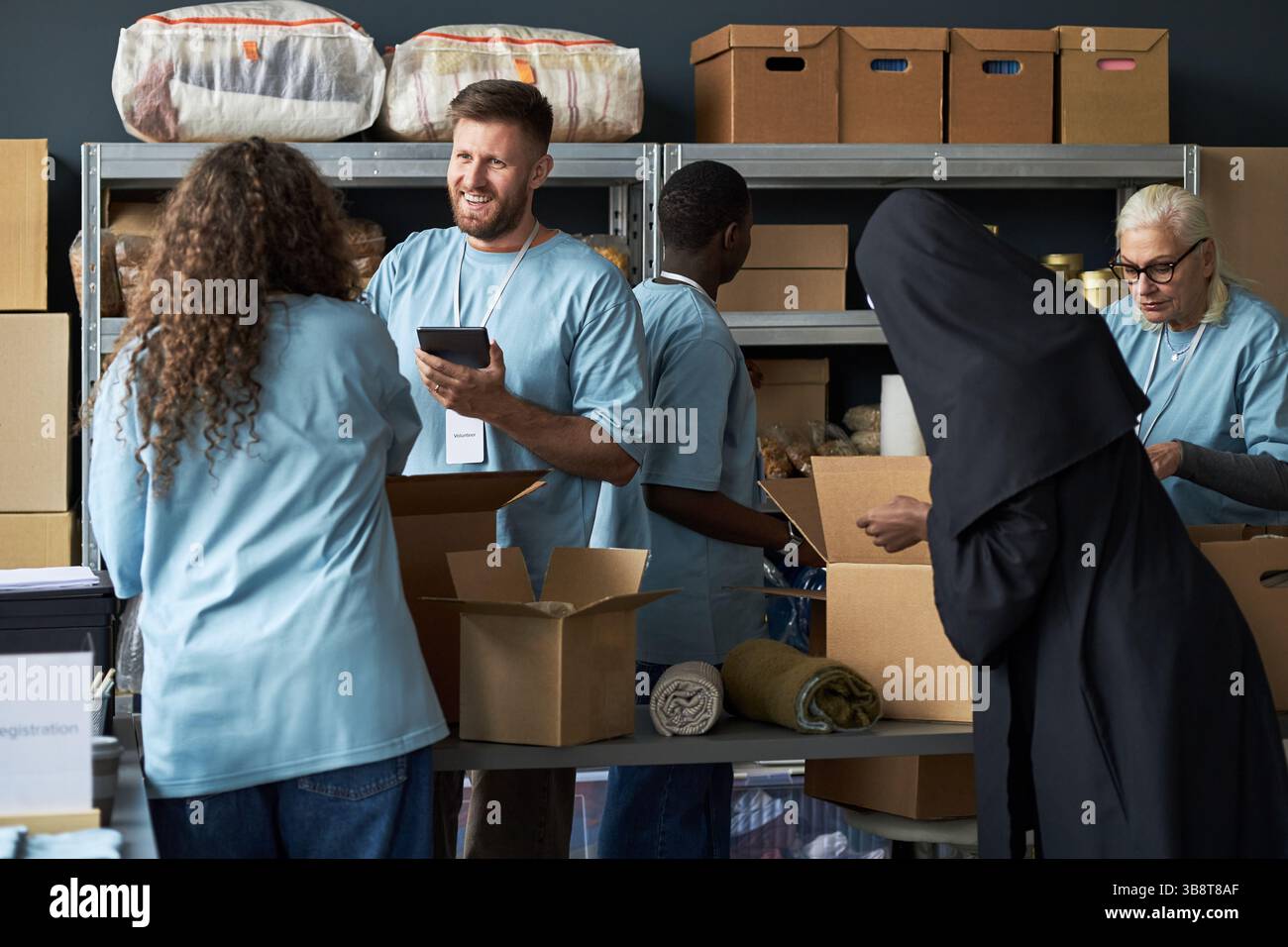 Community donation effort volunteers hi-res stock photography and ...