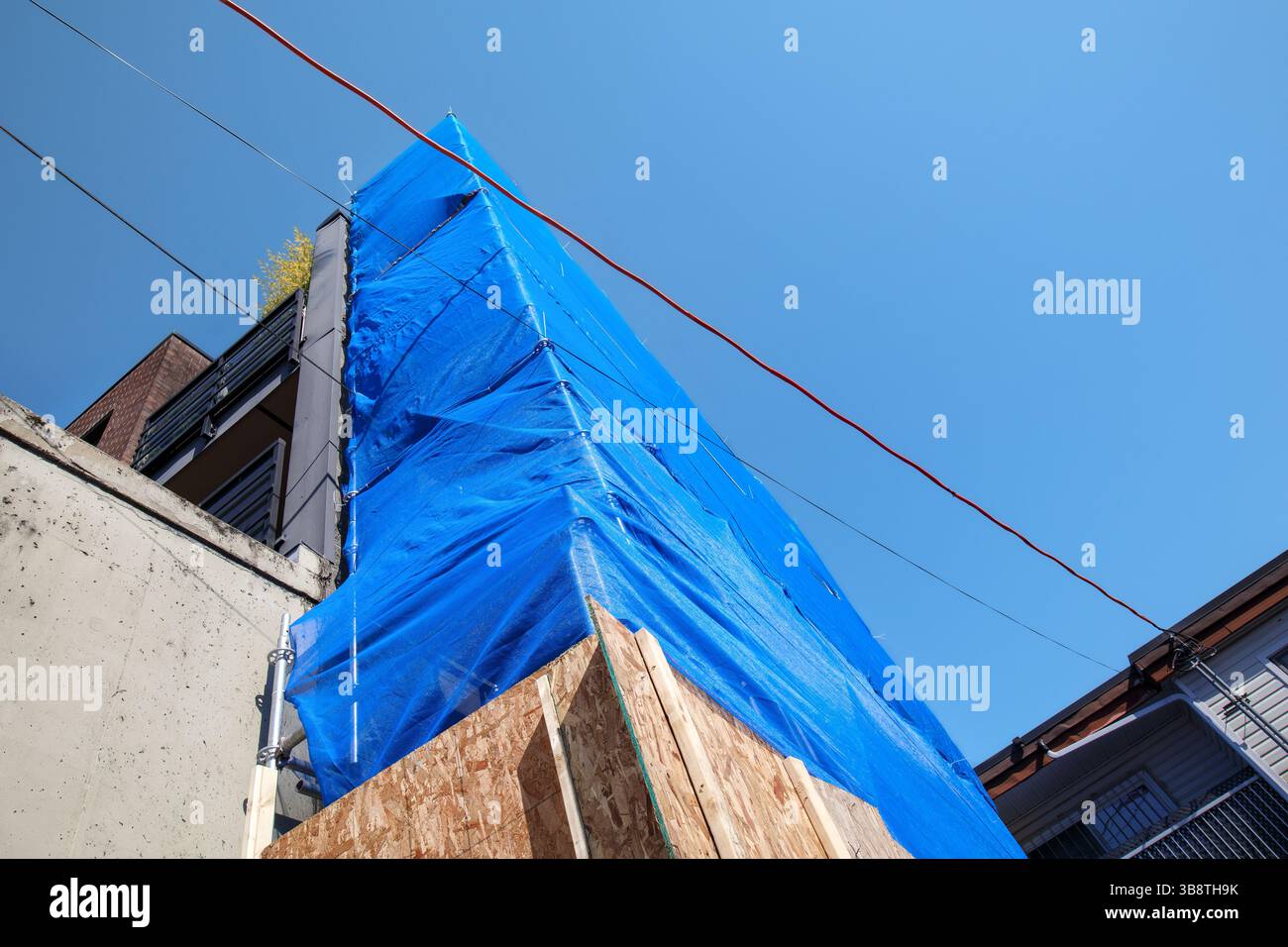 Scaffolding netting or scaffold mesh on building facade scaffolding ...