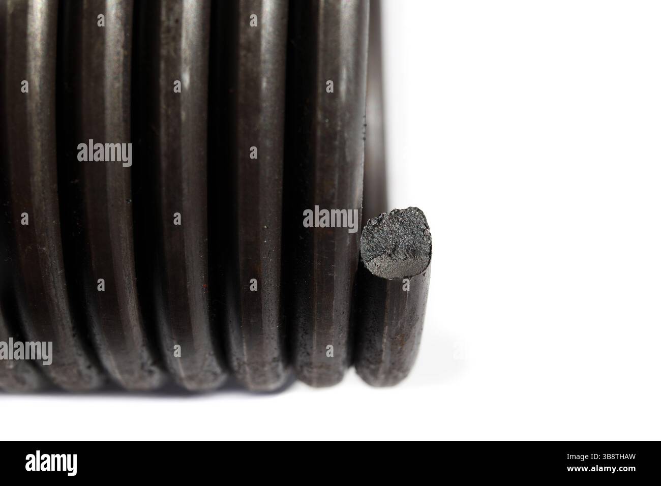 Close up of broken spring or torsion spring for overhead sectional door ...