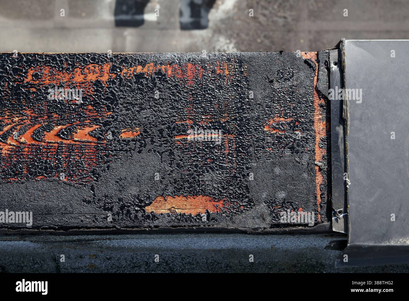 Exposed waterproof membrane next to roof coping. Repair or install ...