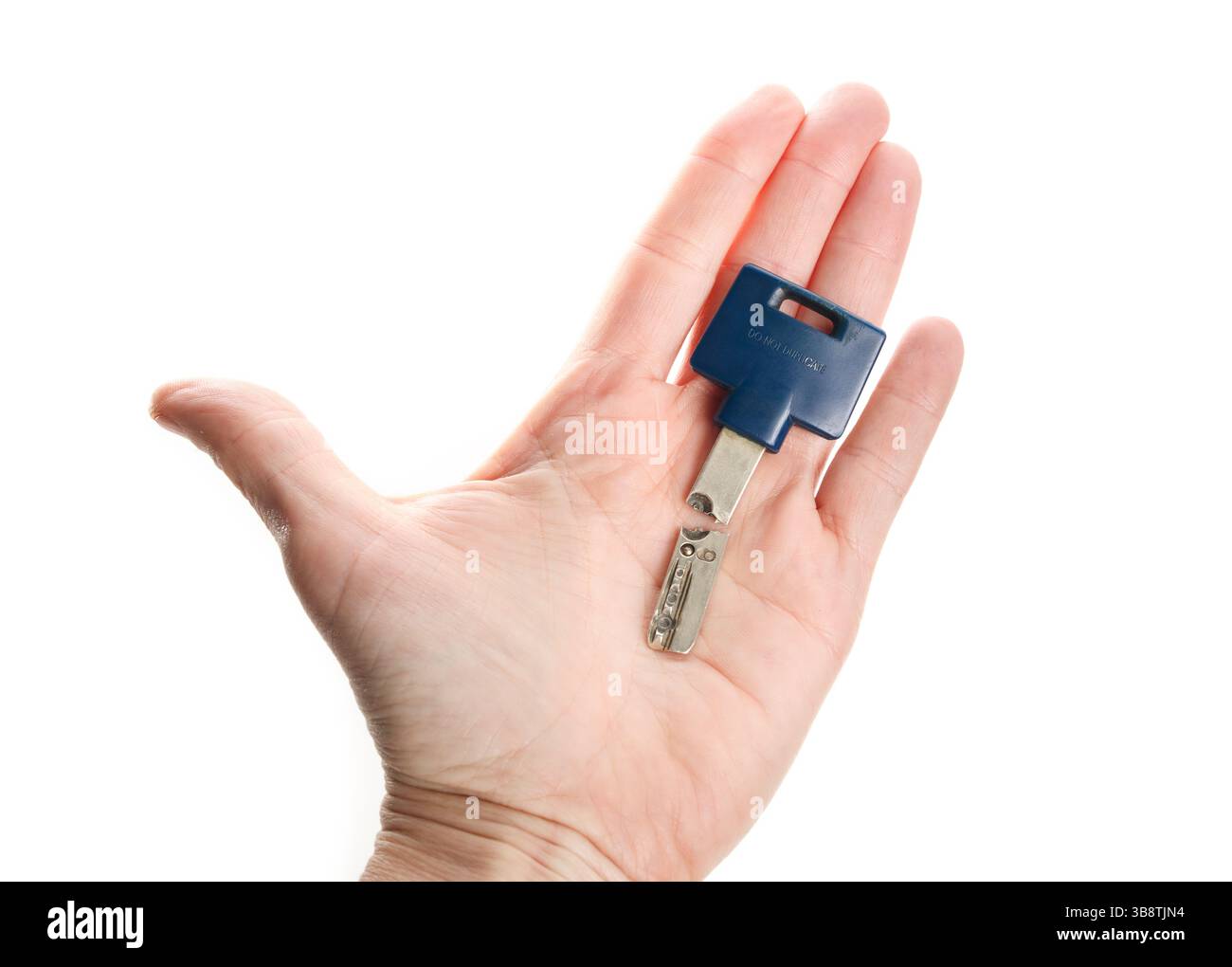 Broken key held by hand. Key snapped in two pieces. House key for ...