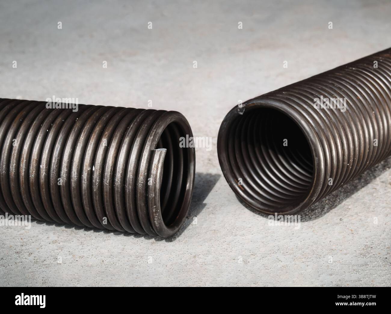 Broken garage gate spring or torsion spring from overhead sectional ...