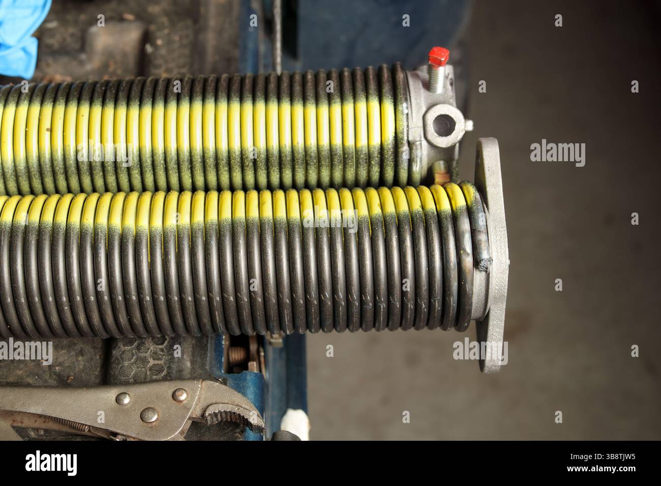 New garage door spring or coil ready to be installed. Parking gate ...
