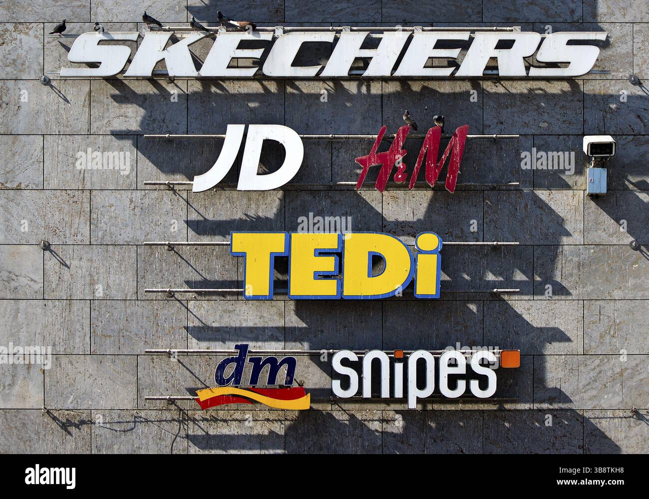 Facade of Forum Hanau with company logos at the shopping centre ...