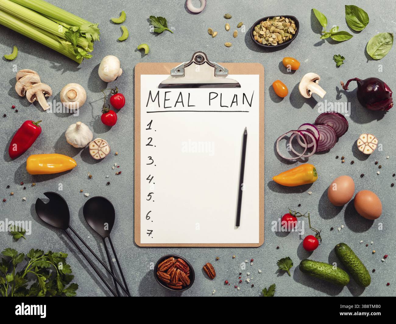 Meal plan concept. Food ingredients, salad serving utensils and ...