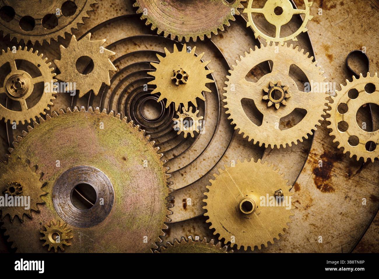 Steampunk background from mechanical clocks details over old metal ...