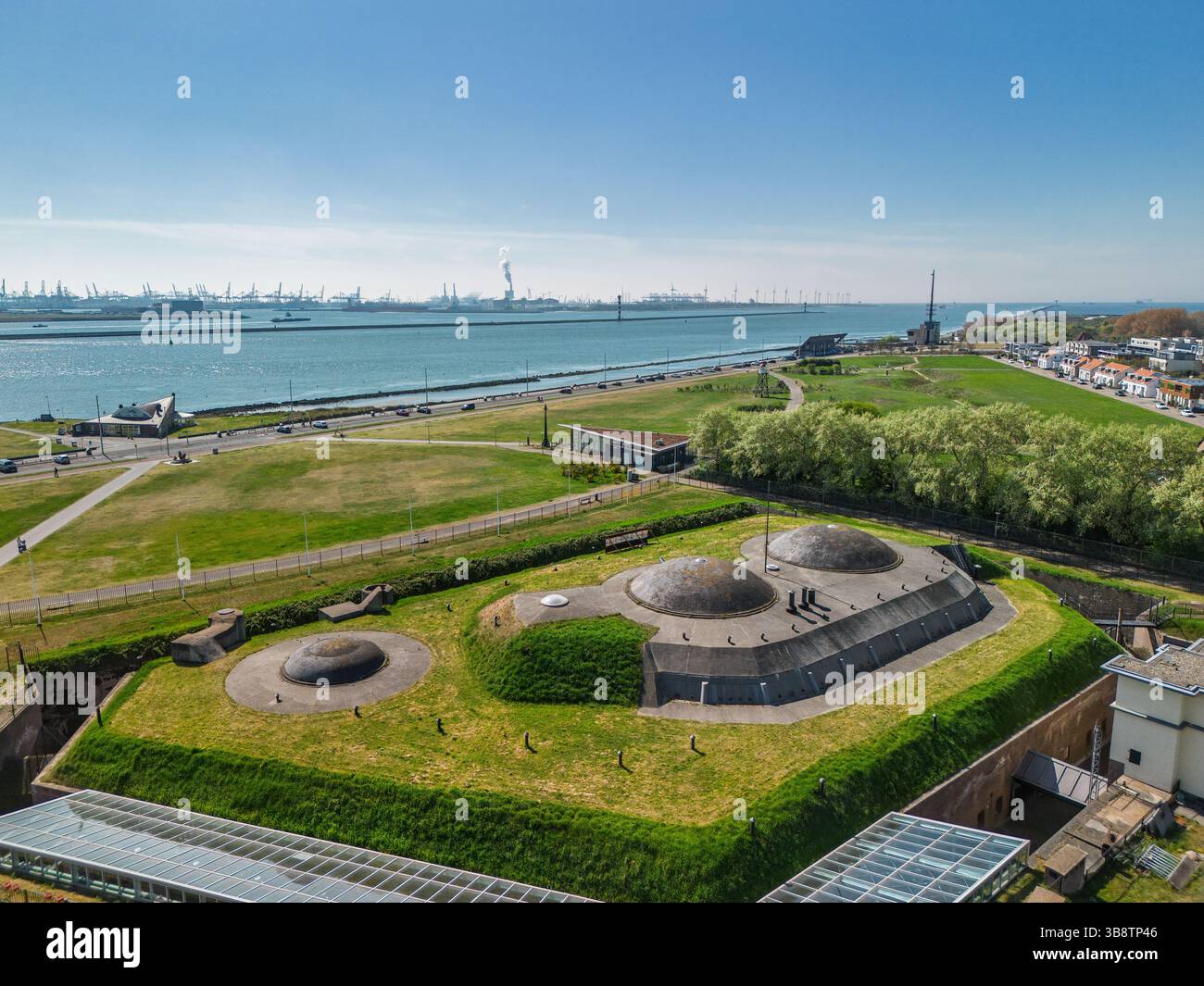 Aerial view of historic coastal fort with bunkers, grassy landscape and ...