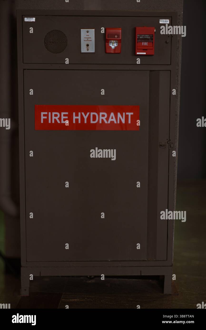 Red Fire Hydrant Safe on the Wall Stock Photo - Alamy
