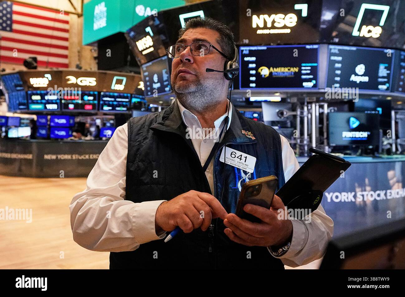 Trader Michael Capolino works on the floor of the New York Stock ...