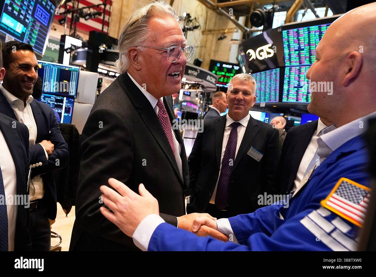Mark Cloutier, left, Executive Chairman & Group CEO of Aspen, shakes ...
