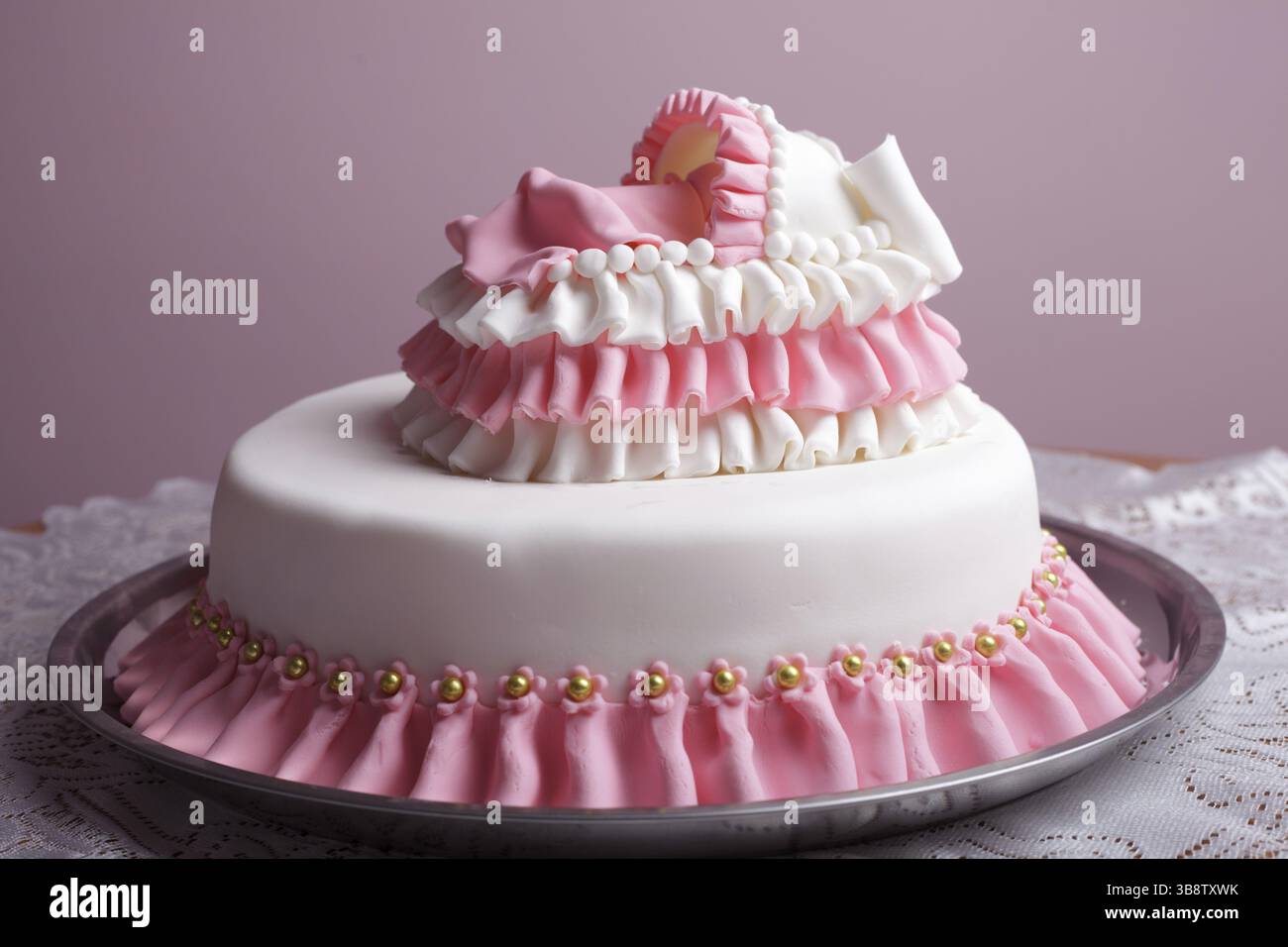 Birthday cake with mastic and little baby in bed Stock Photo - Alamy