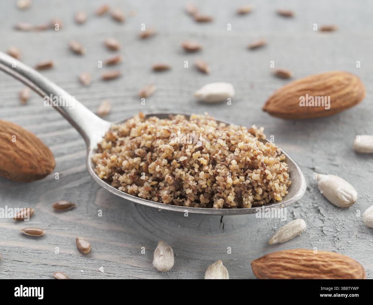 Homemade LSA mix in spoon - Linseed or flax seeds, Sunflower seeds and ...