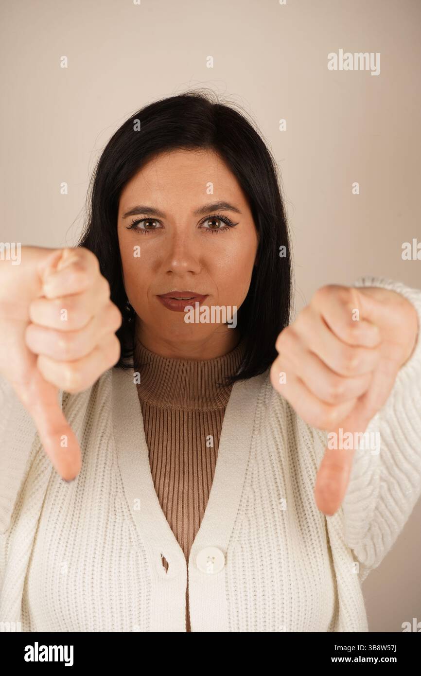 Her focused expression emphasizes the emotion of dislike. A clear ...