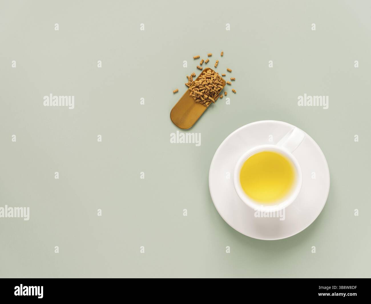 Cups of buckwheat tea on light green background. Top view of healthy ...