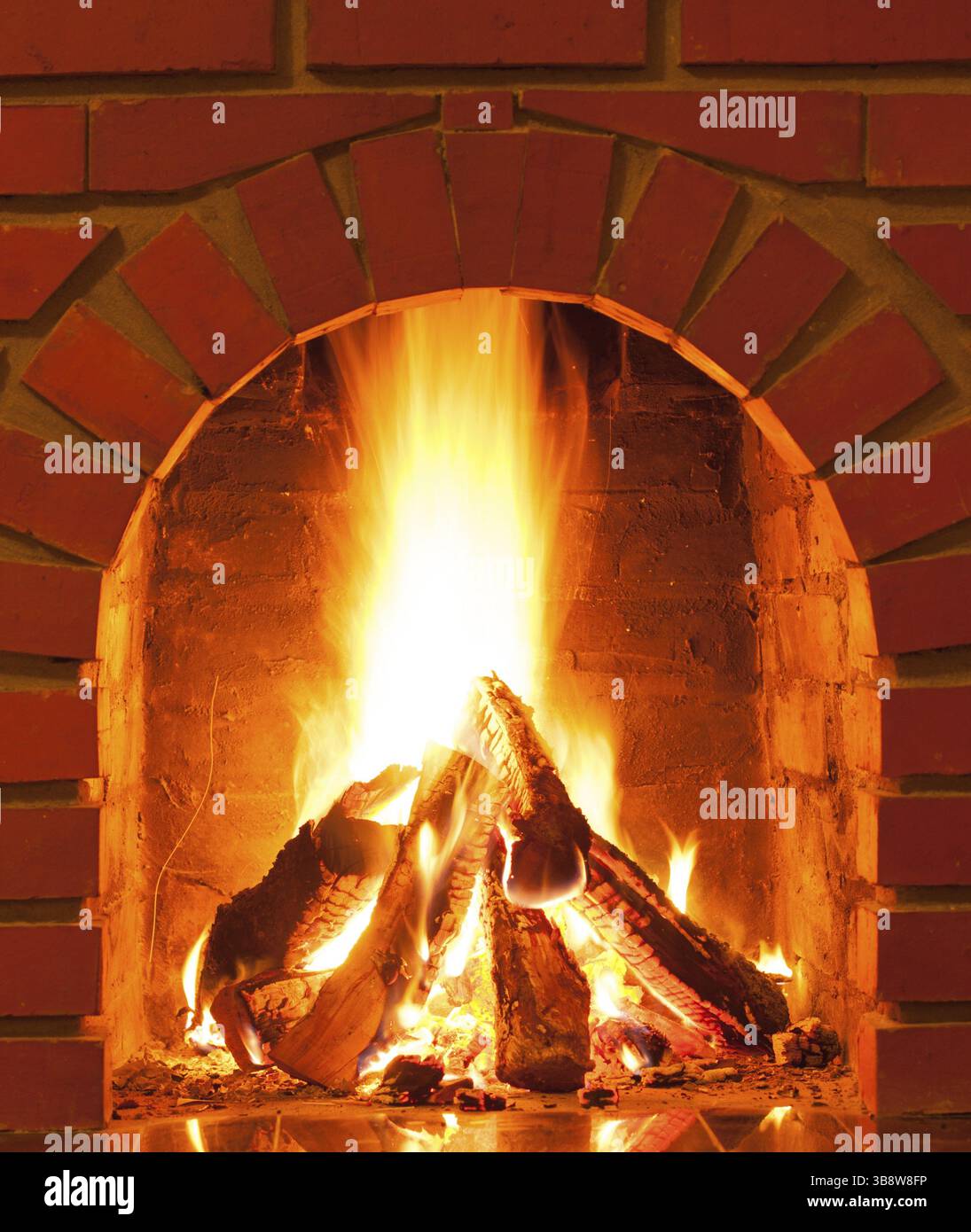 Burning fire in the brick fireplace, close up Stock Photo - Alamy
