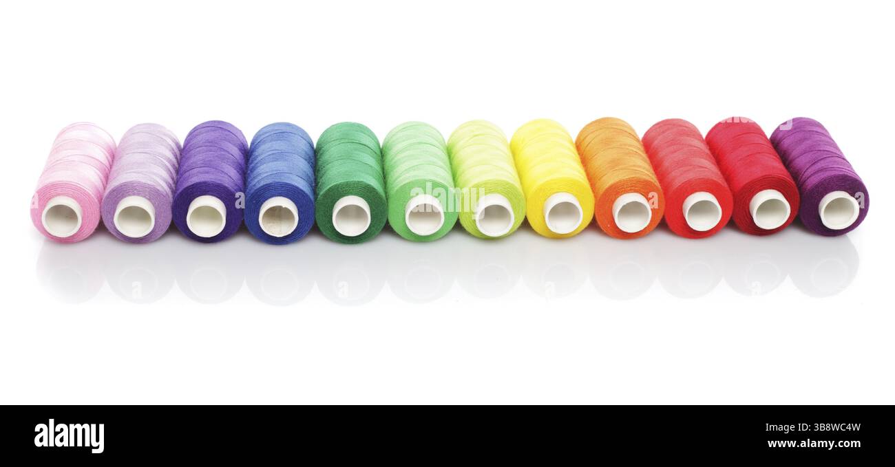Sewing multicolored threads isolated on white Stock Photo - Alamy