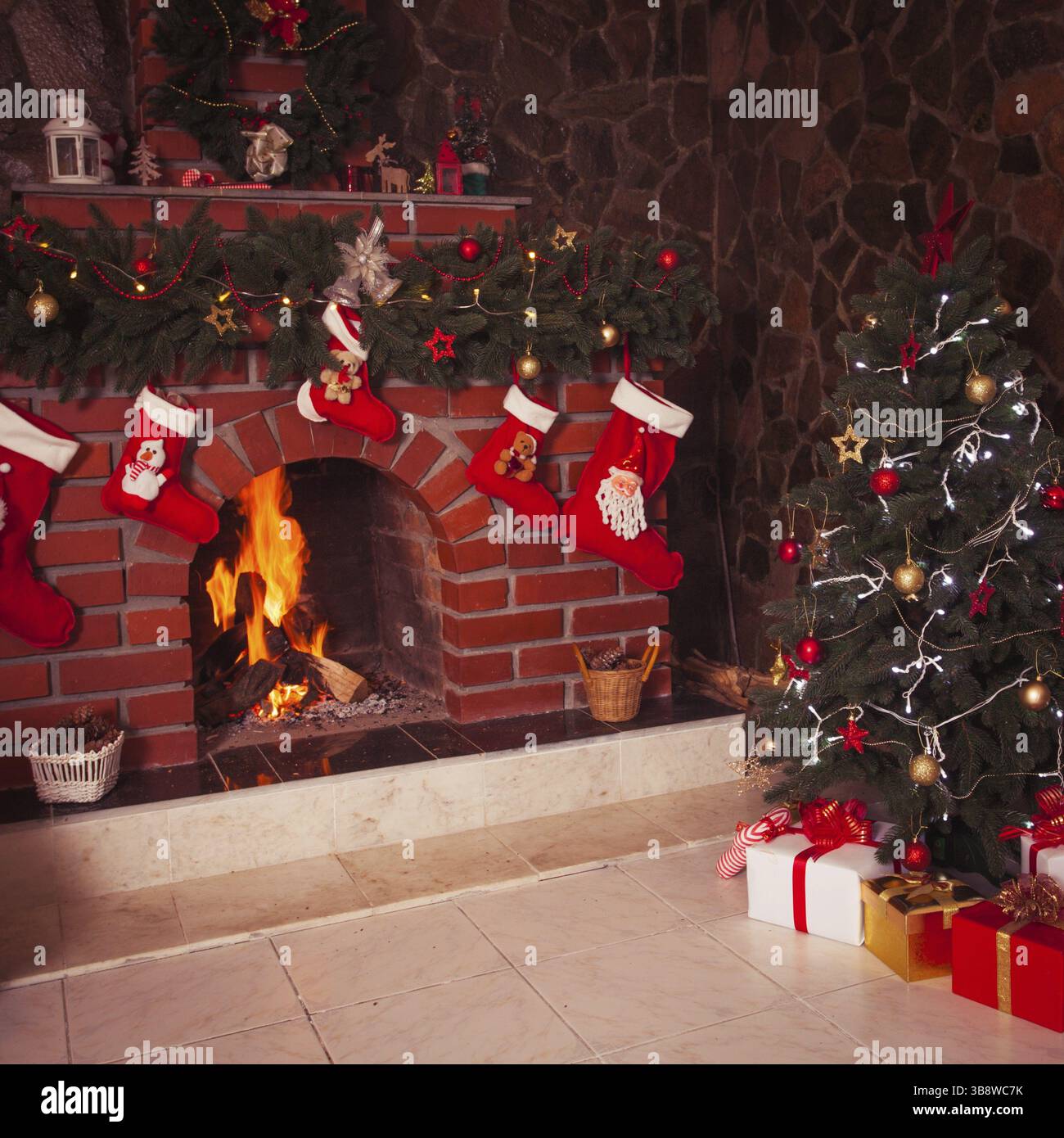 Christmas decorated fireplace and tree in the room Stock Photo - Alamy