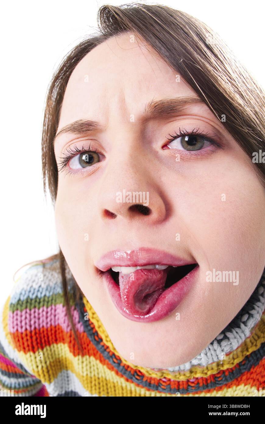 Distorted curious girl's face with tongue out closeup Stock Photo - Alamy