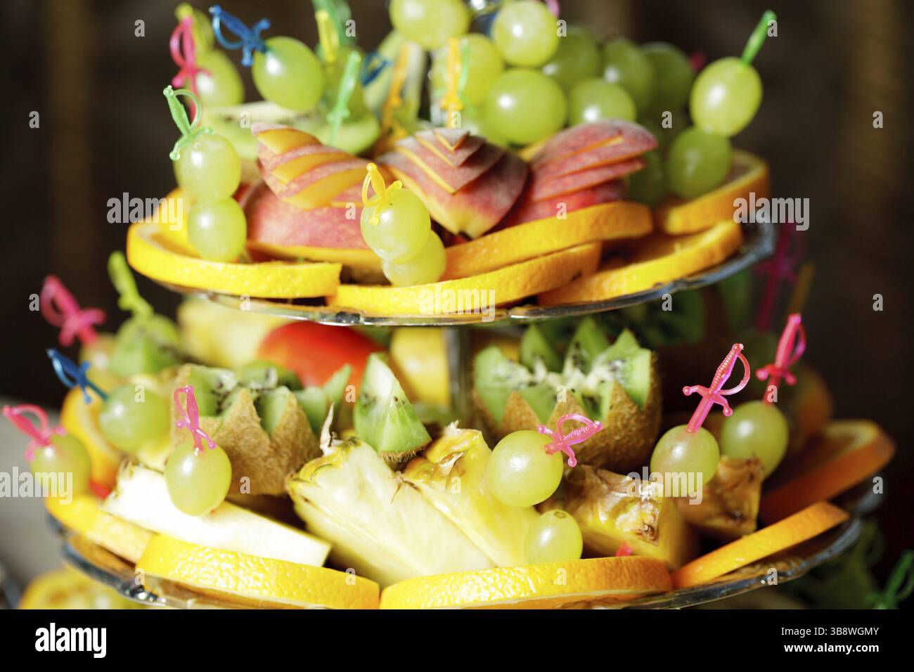 Various slices of fruits on the silver stand prepared for eating Stock ...