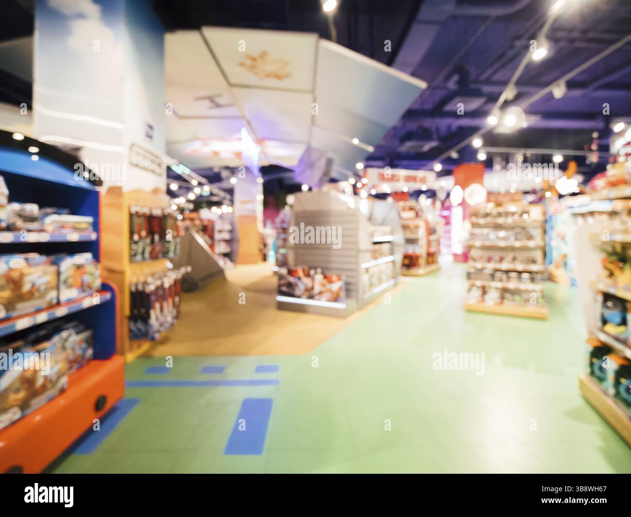 Blurred of kids toy store background with bokhe. Purple and yellow ...