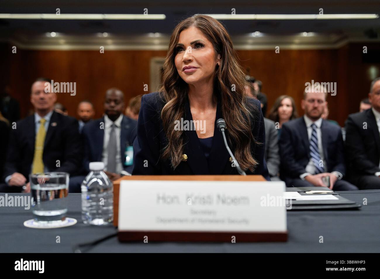 Homeland Security Secretary Kristi Noem takes her seat before a Senate ...