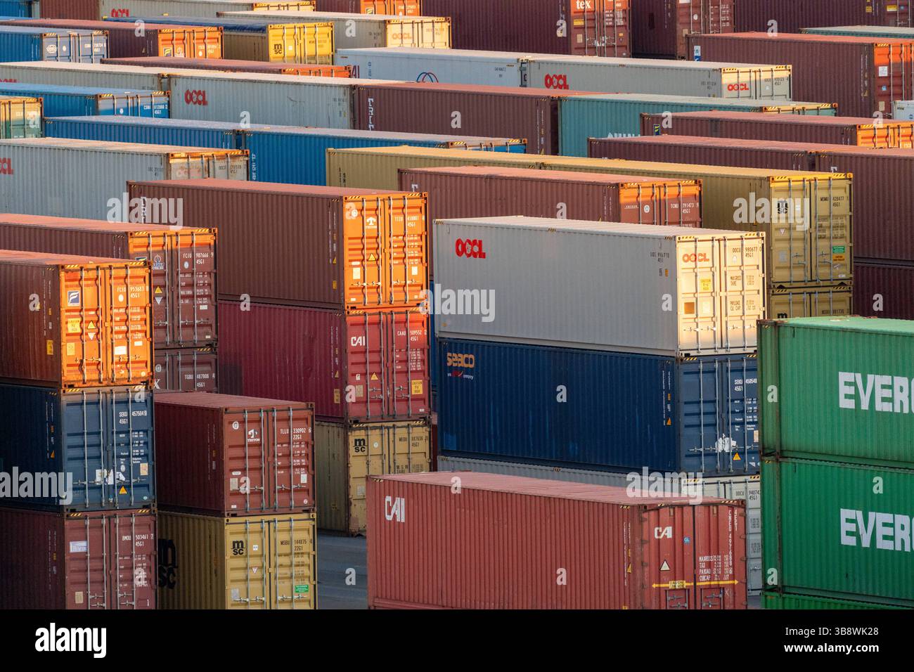 Hamburg, Germany - 27 April 2025: Stacked freight containers at a terminal in the Port of ...