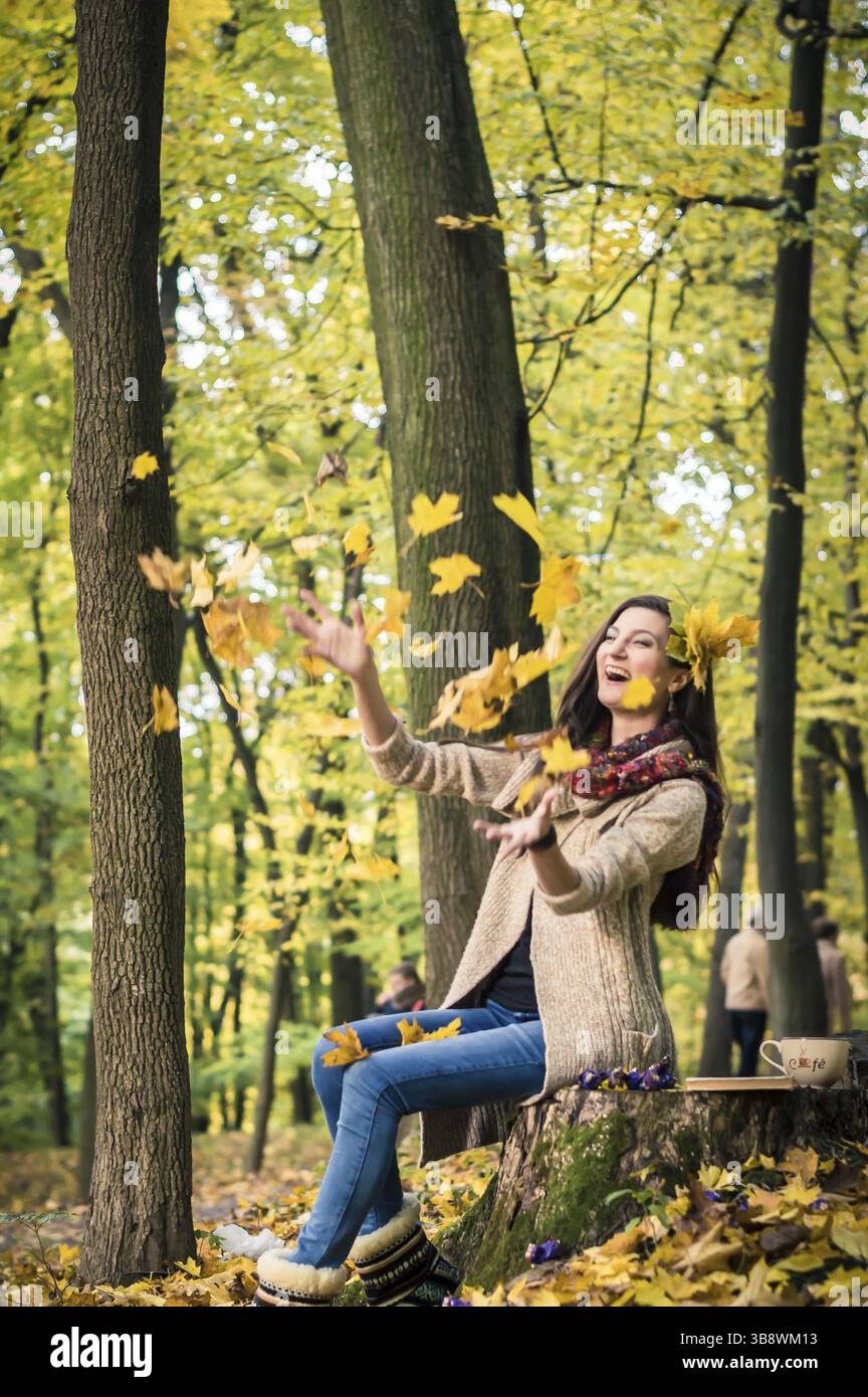 Girl throws up autumn hi-res stock photography and images - Alamy