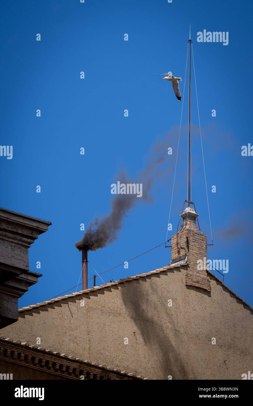 Vatican, Vatican. 08th May, 2025. Black smoke billows from the Sistine ...