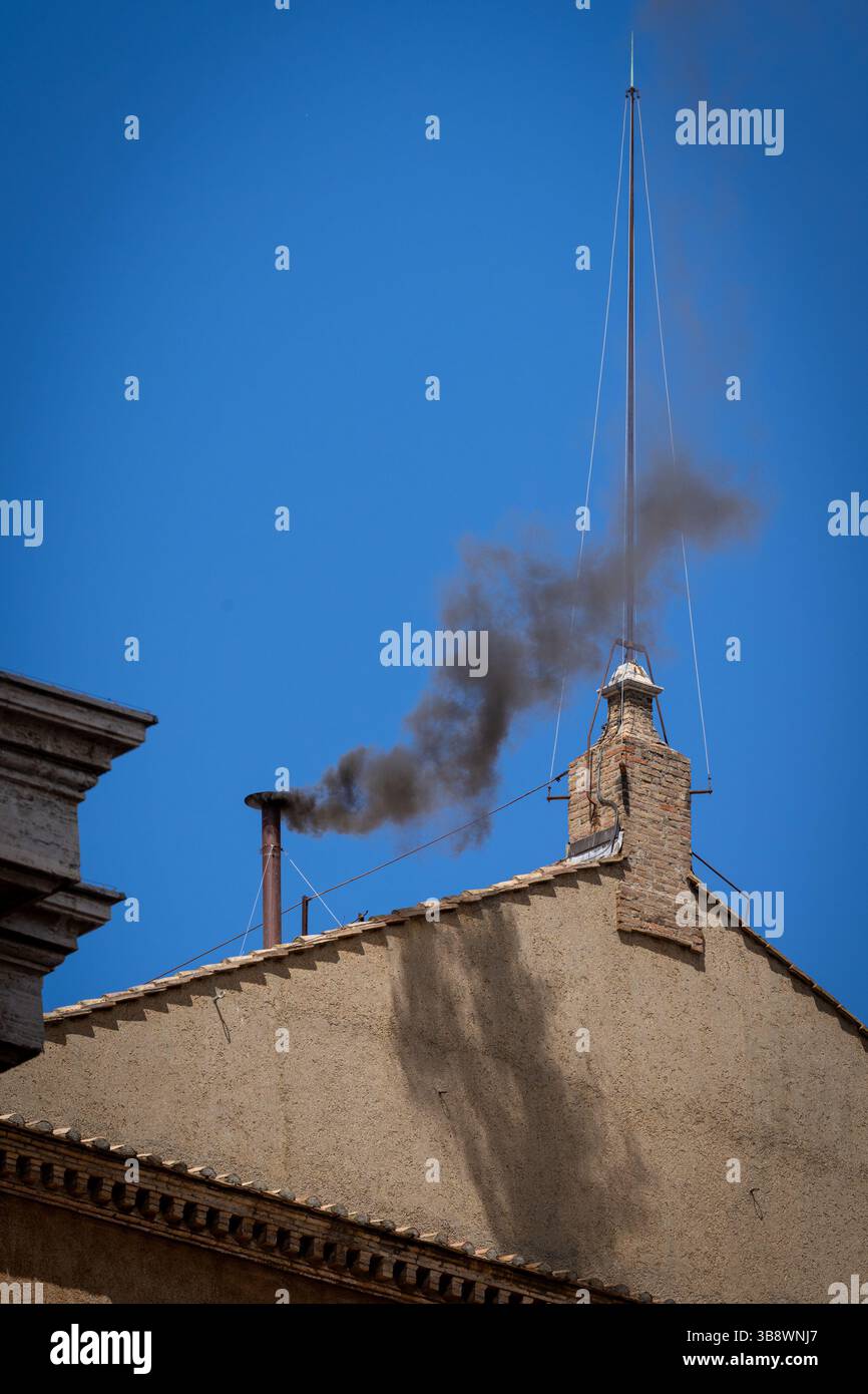 Vatican, Vatican. 08th May, 2025. Black smoke billows from the Sistine ...