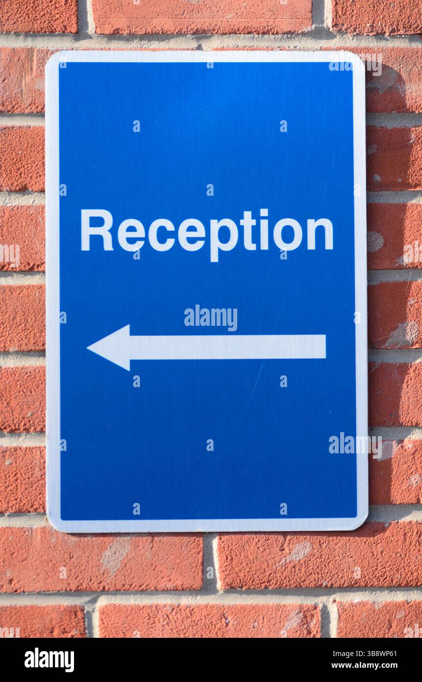 A sign pointing the way to the reception UK Stock Photo - Alamy