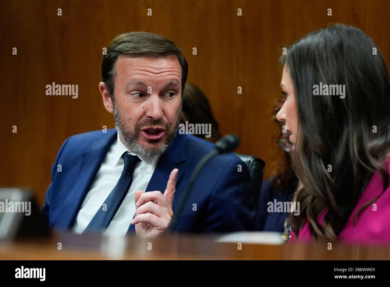 Sen. Chris Murphy, D-Conn., speaks, left, with Sen. Katie Britt, R-Ala., during a Senate ...