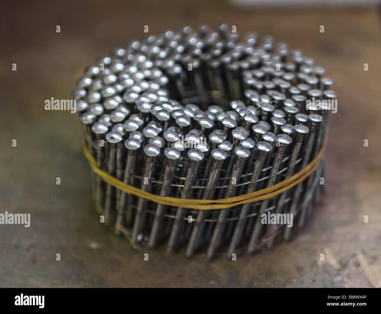 Rustic iron nails on a iron background Stock Photo - Alamy