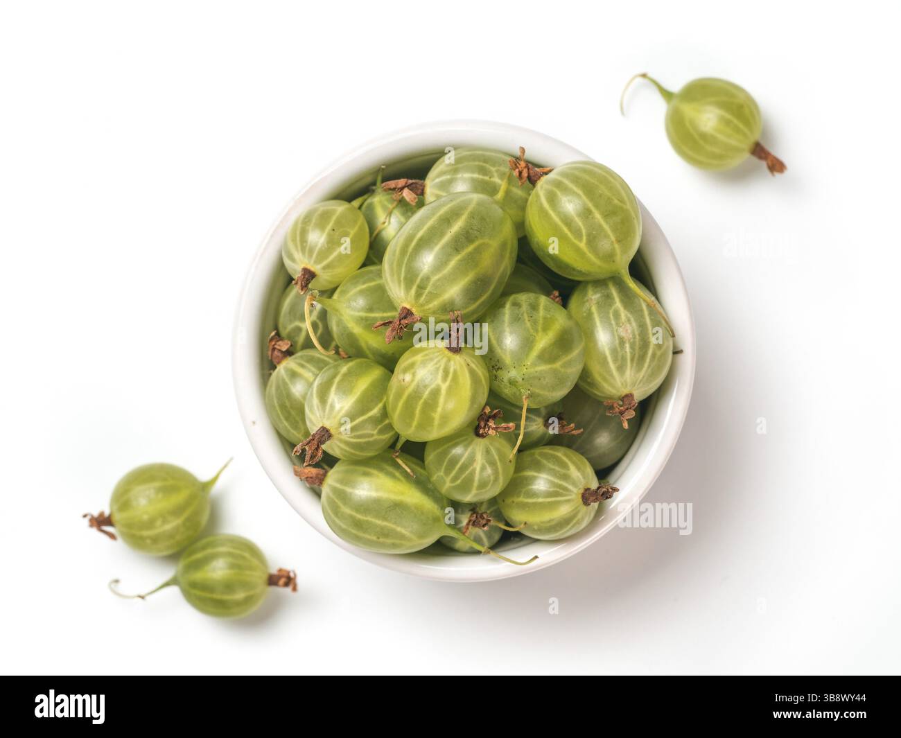 View from above of ripe green gooseberry in small bowl on white ...